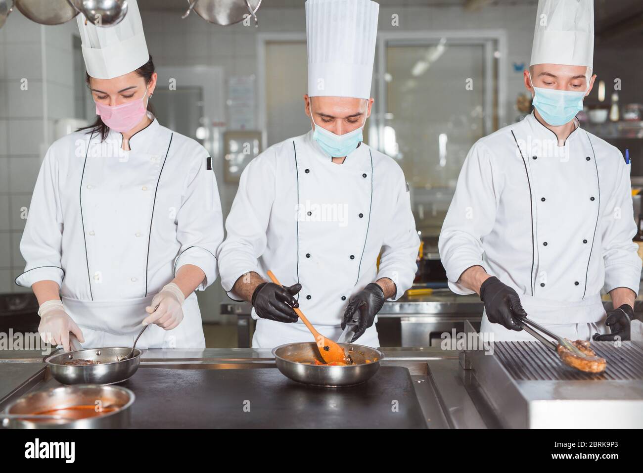 Restaurant team waiter cooker hi-res stock photography and images - Alamy
