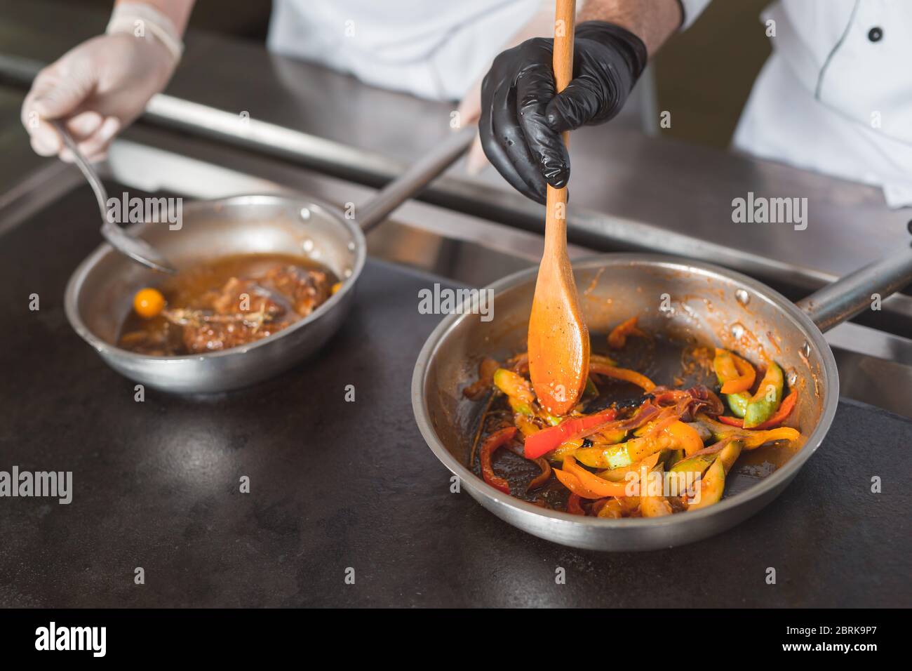 team of cooks cooks in a restaurant Stock Photo - Alamy