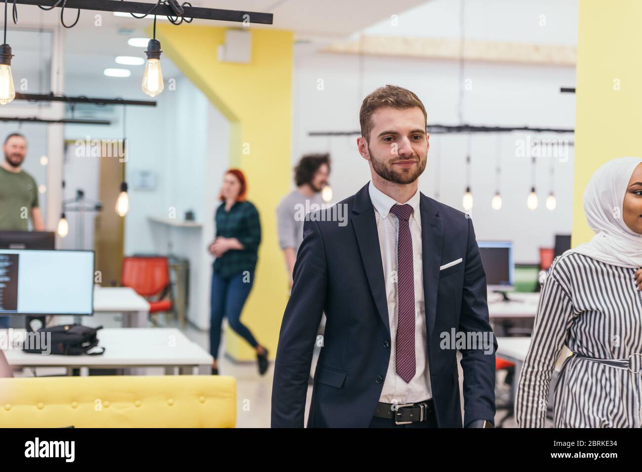Business executives walking through a modern office. Marketing, economy ...