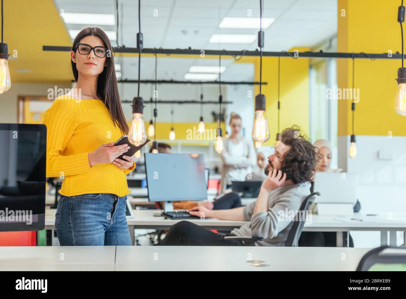 Female boss, manager executive posing in a modern startup office while ...