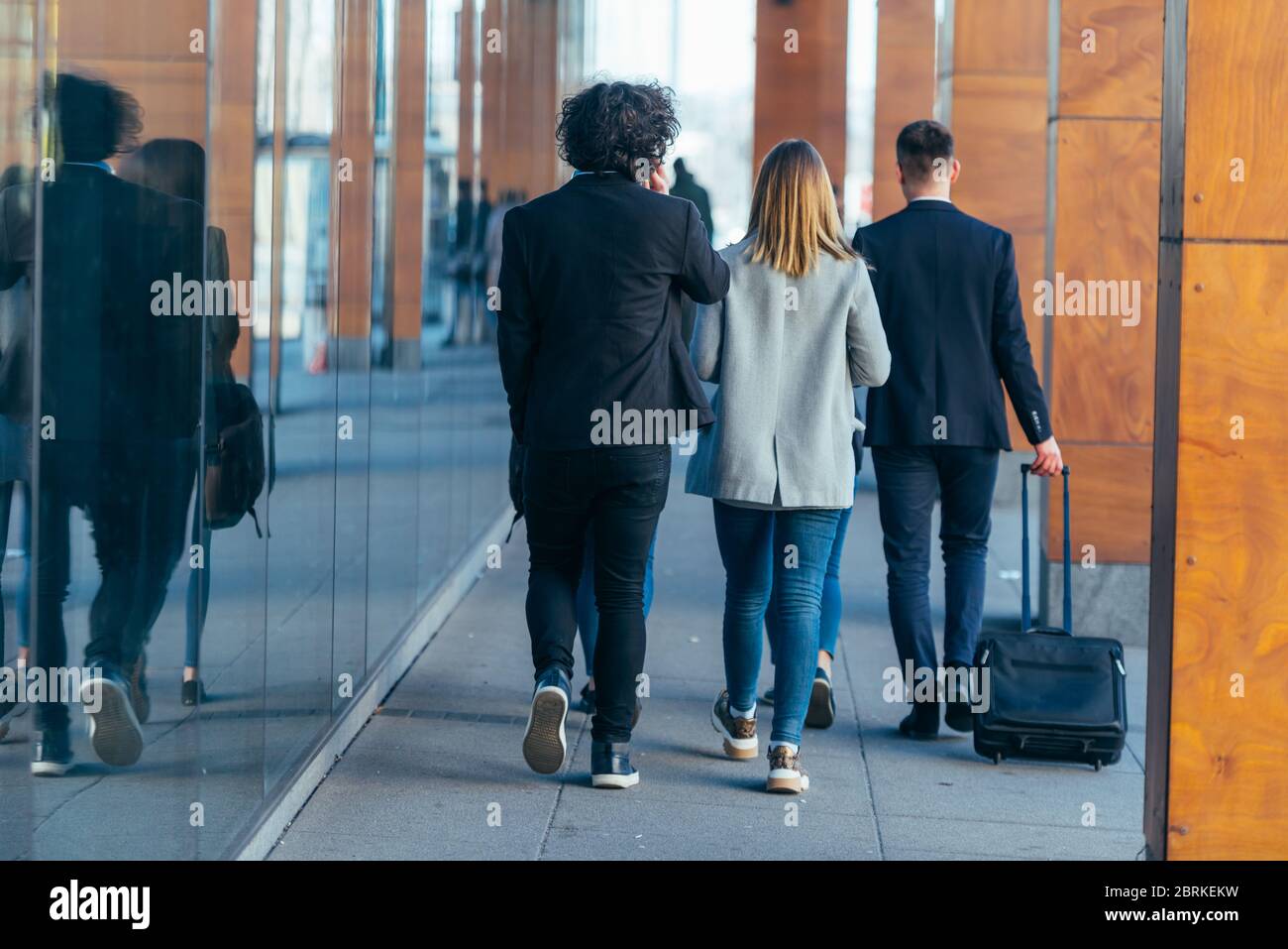 Group of colleagues on a business trip (euro trip) walking together at ...