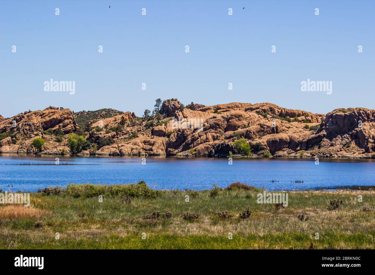 Shoreline Of Mountain Lake With Unique Rock Shoreline Stock Photo - Alamy