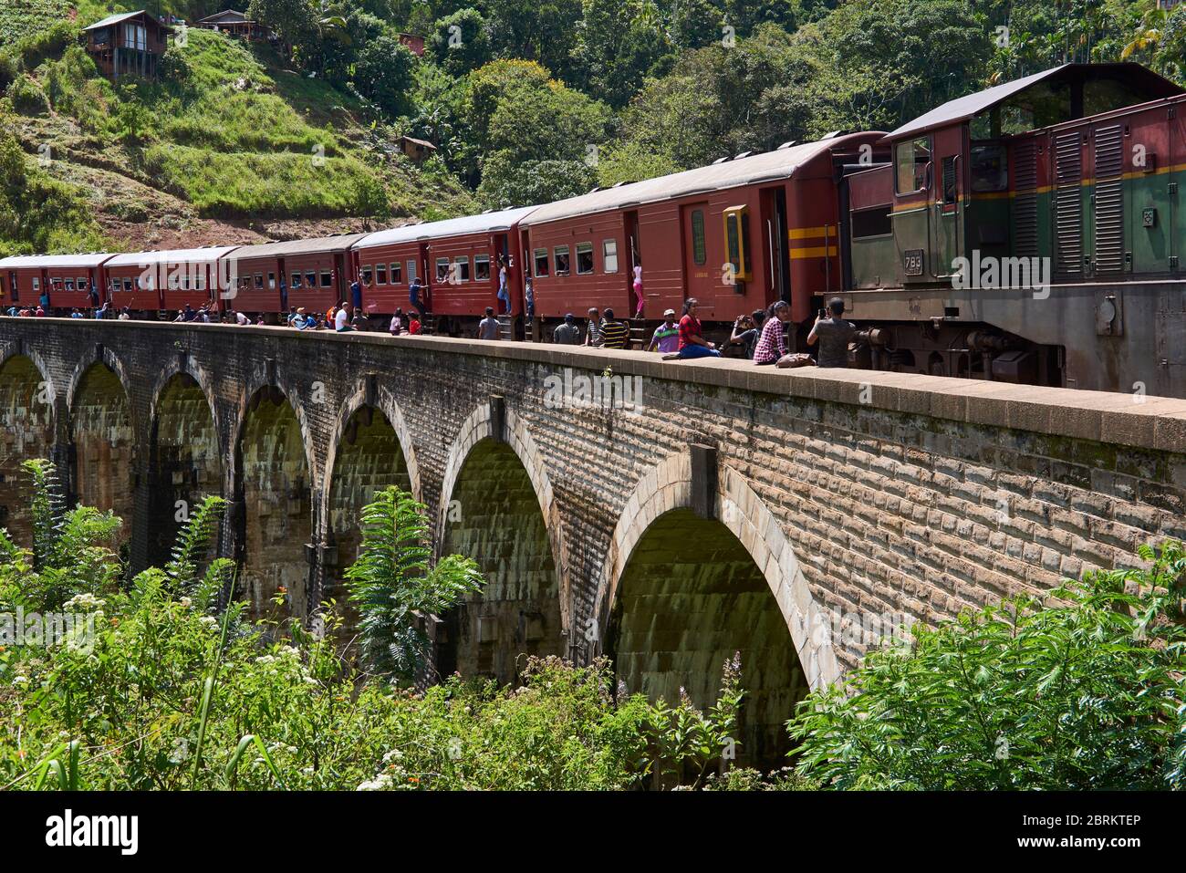 Old style train stationed on Nine Arch Bridge in Ella, Sri Lanka Stock ...