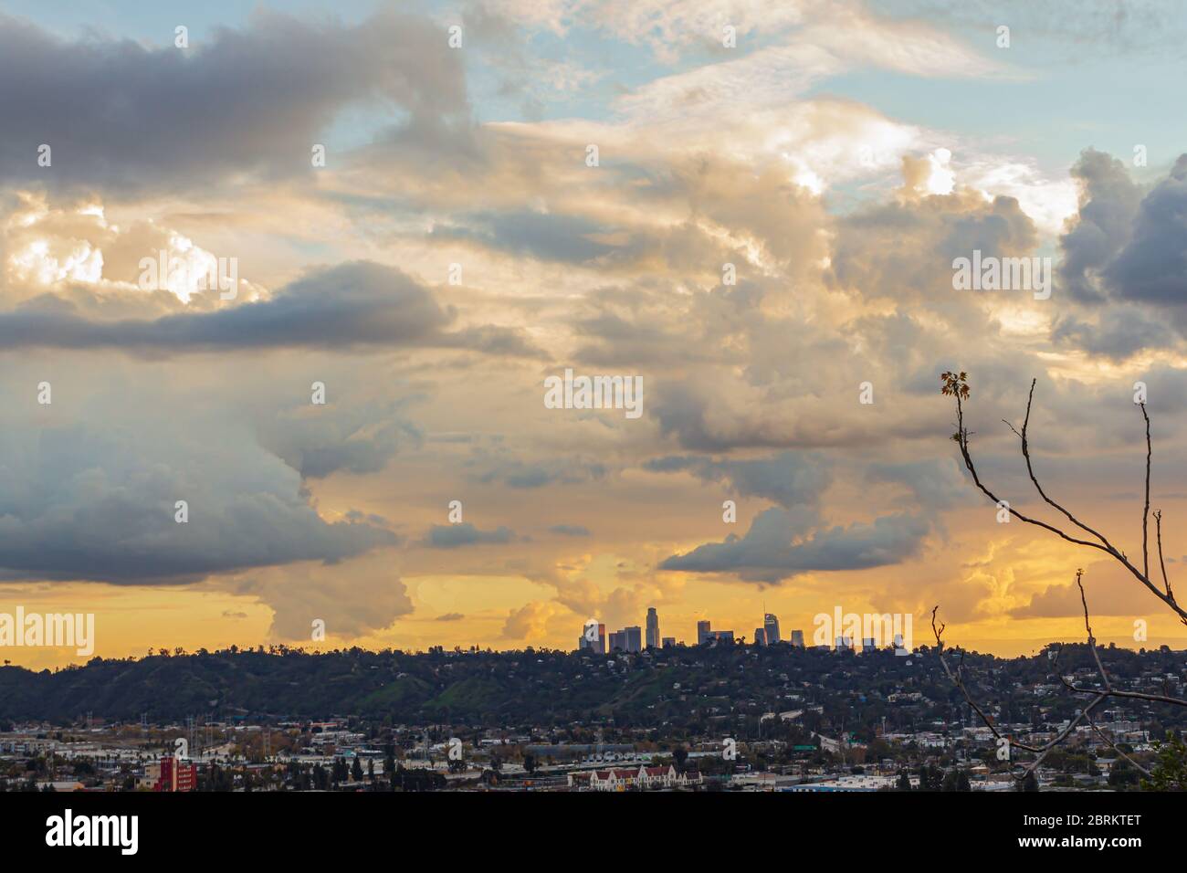 city scape and downtown city towers with panaramic sunset clouds in ...