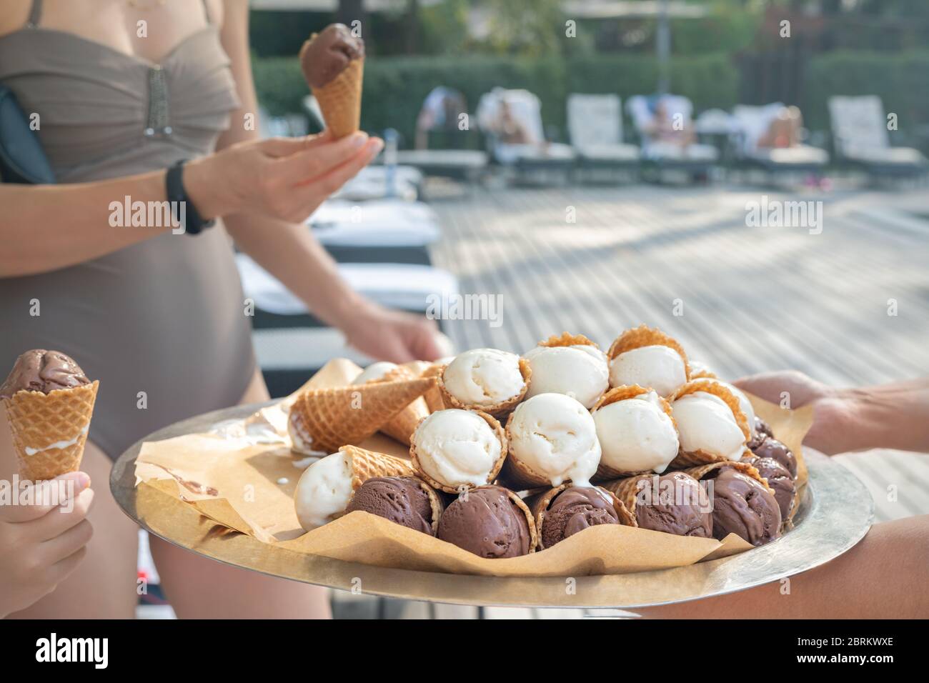 Pool waiter lounger hi-res stock photography and images - Alamy