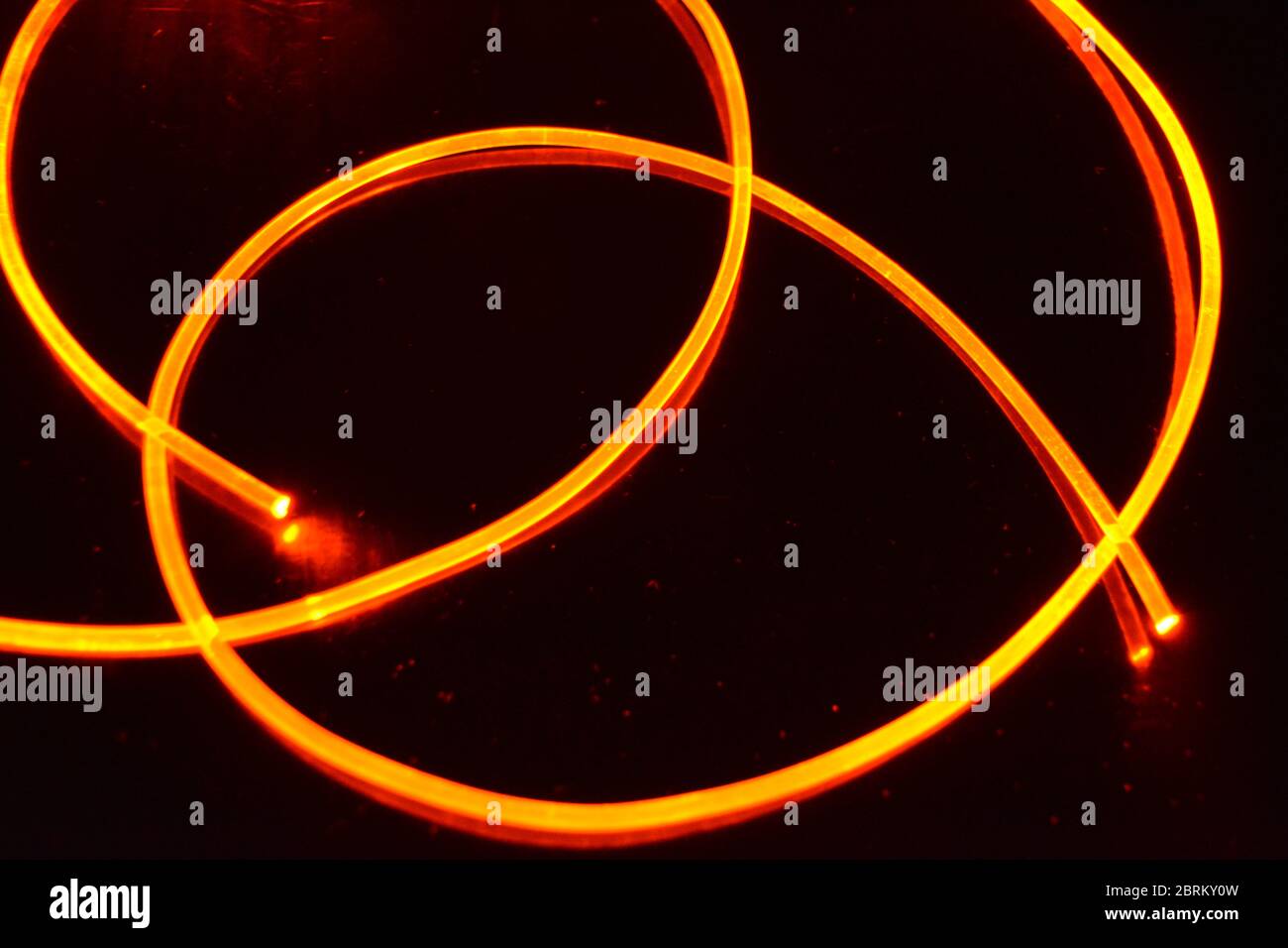 A light guide, a wire with orange light, a light guide wire with ...