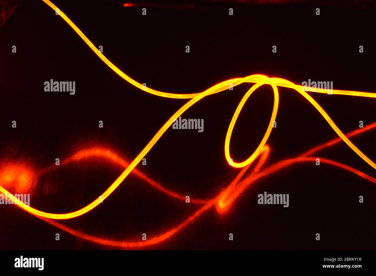 A light guide, a wire with orange light, a light guide wire with ...