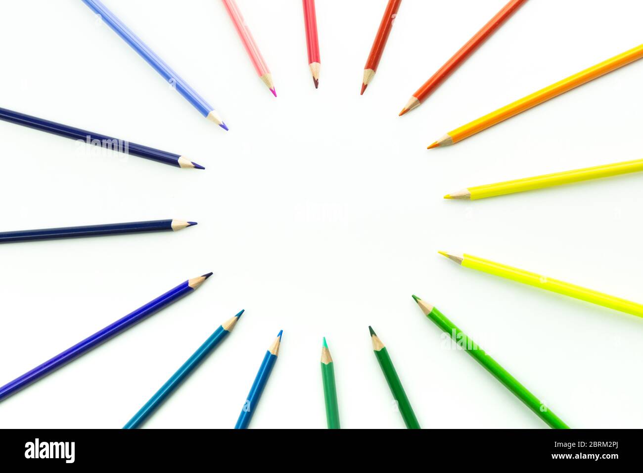 Bright beautiful crayons. Colored pencils in frame of circle isolated ...