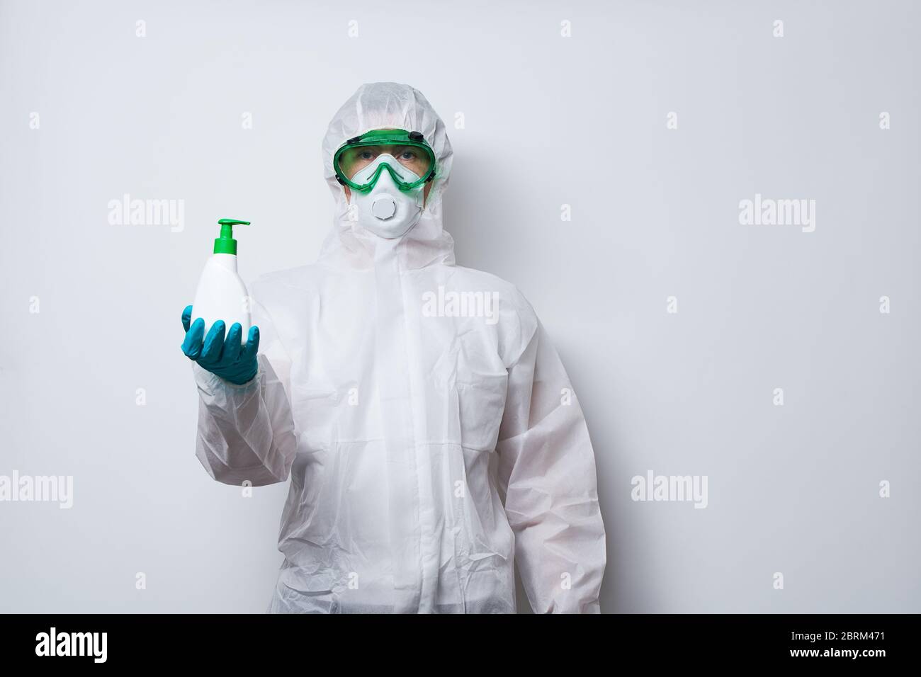 Doctor is wearing PPE - costume, gloves and surgical face mask in ...