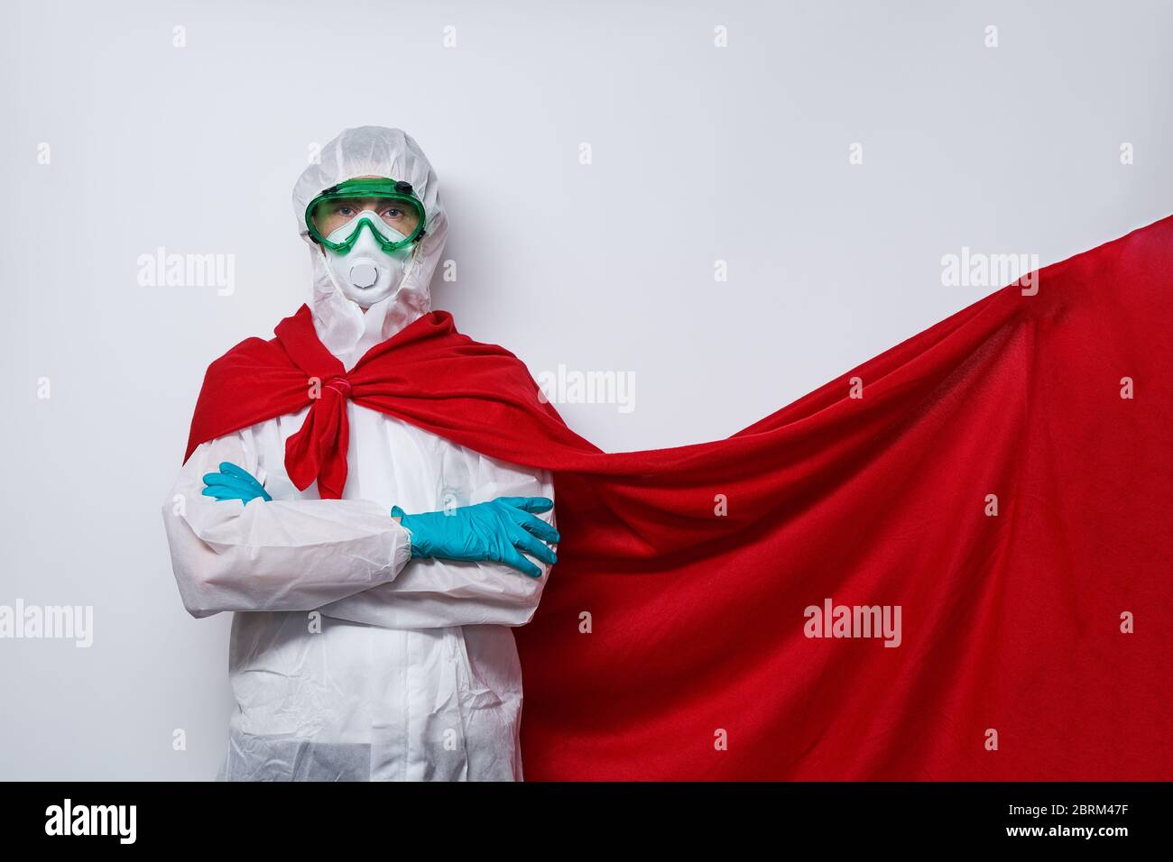 Doctor is wearing PPE - costume, gloves and surgical face mask in ...