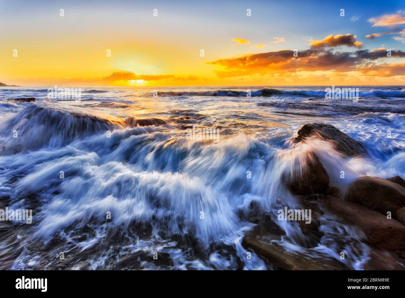 The rising start of the sun over Pacific ocean horizon off Northern ...