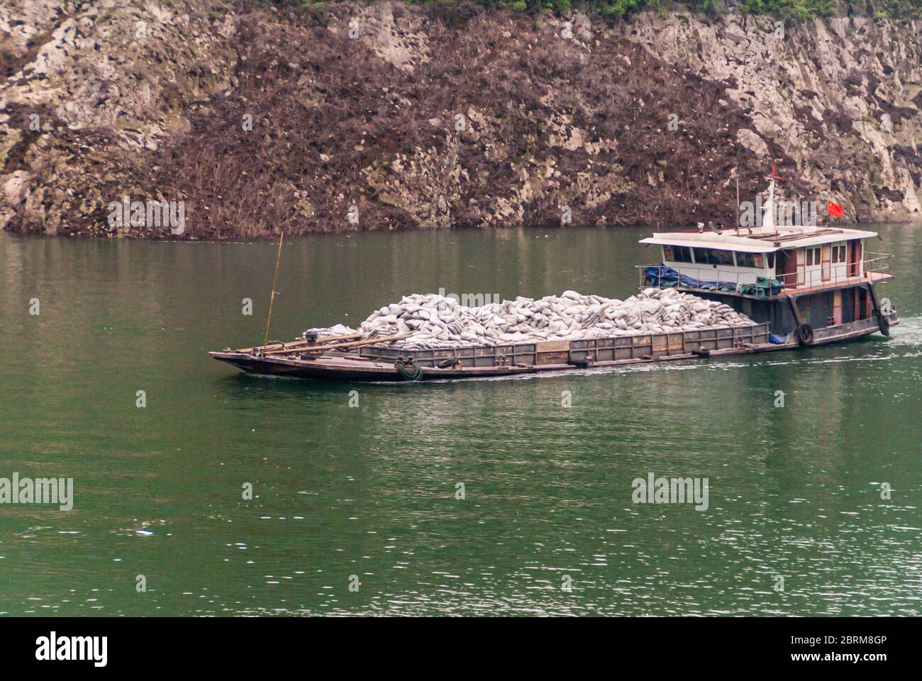 Guandukou, Hubei, China - May 7, 2010: Wu Gorge in Yangtze River. Barge ...