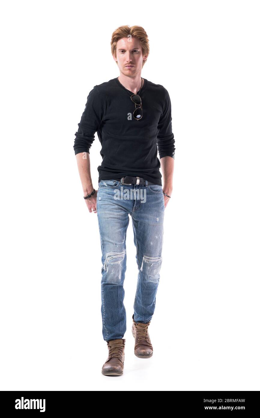 Front view of stylish modern young man walking and approaching to ...