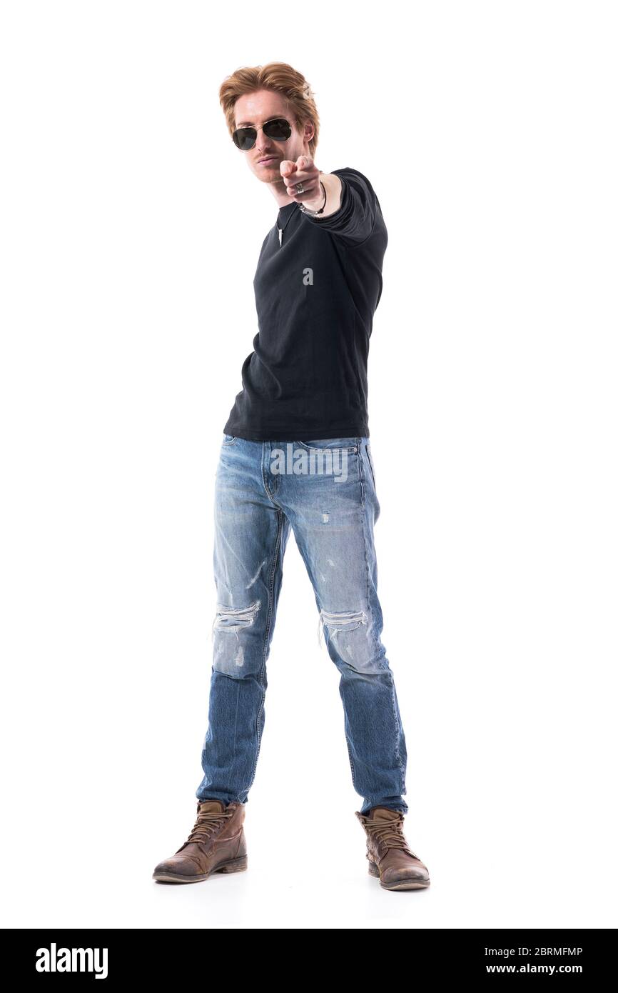 Tough confident man with cocky attitude pointing finger at camera ...
