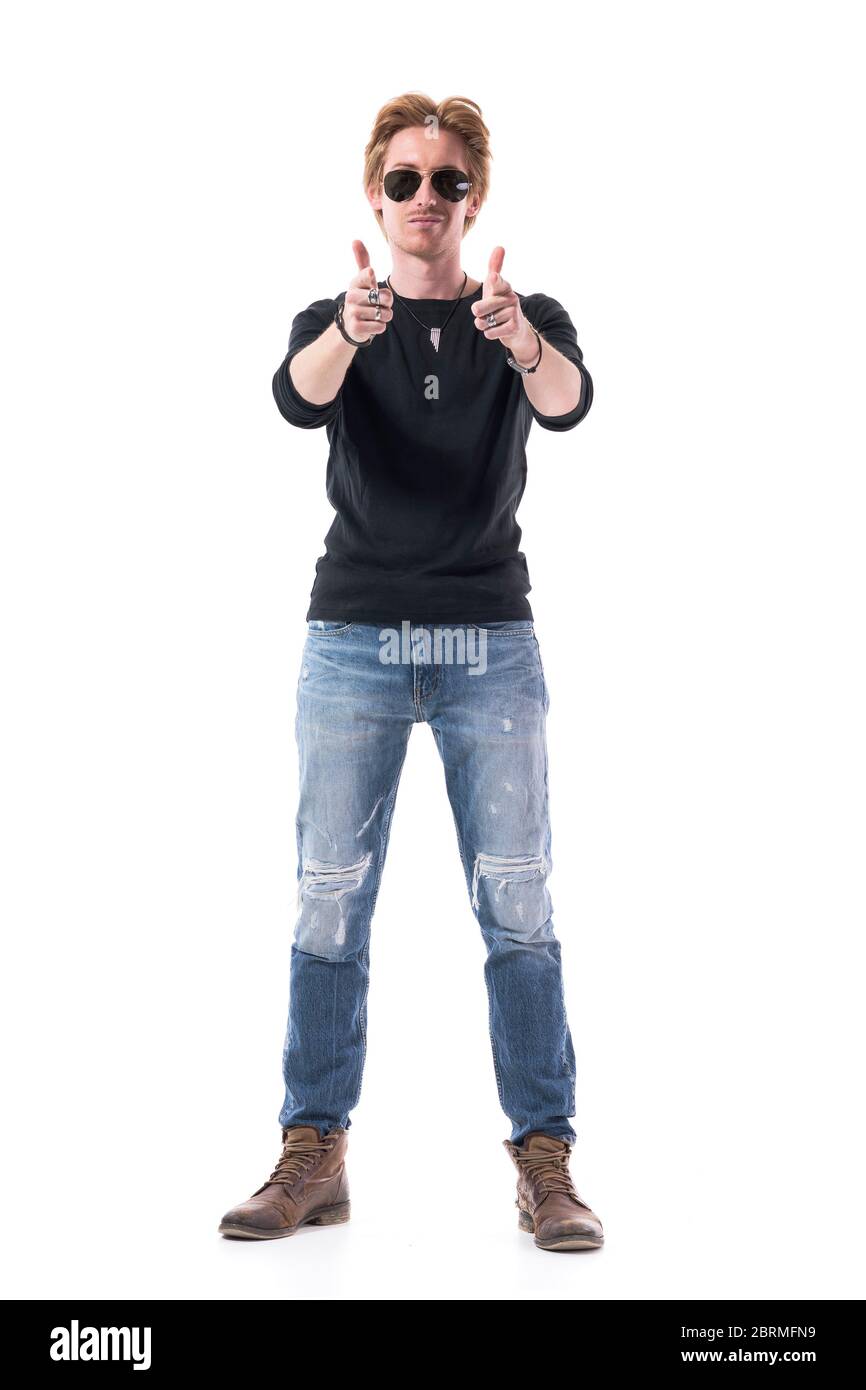 Happy confident stylish man with satisfaction smile pointing finger gun ...