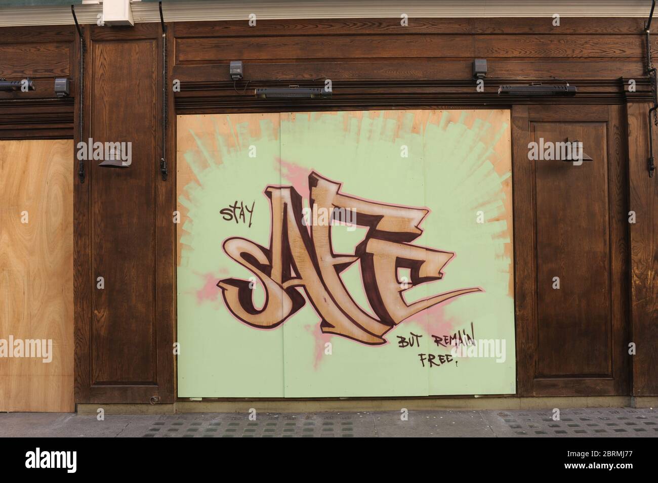 London, UK, 20 May 2020 Graffiti on boarded up Cafe Boheme in Soho ...