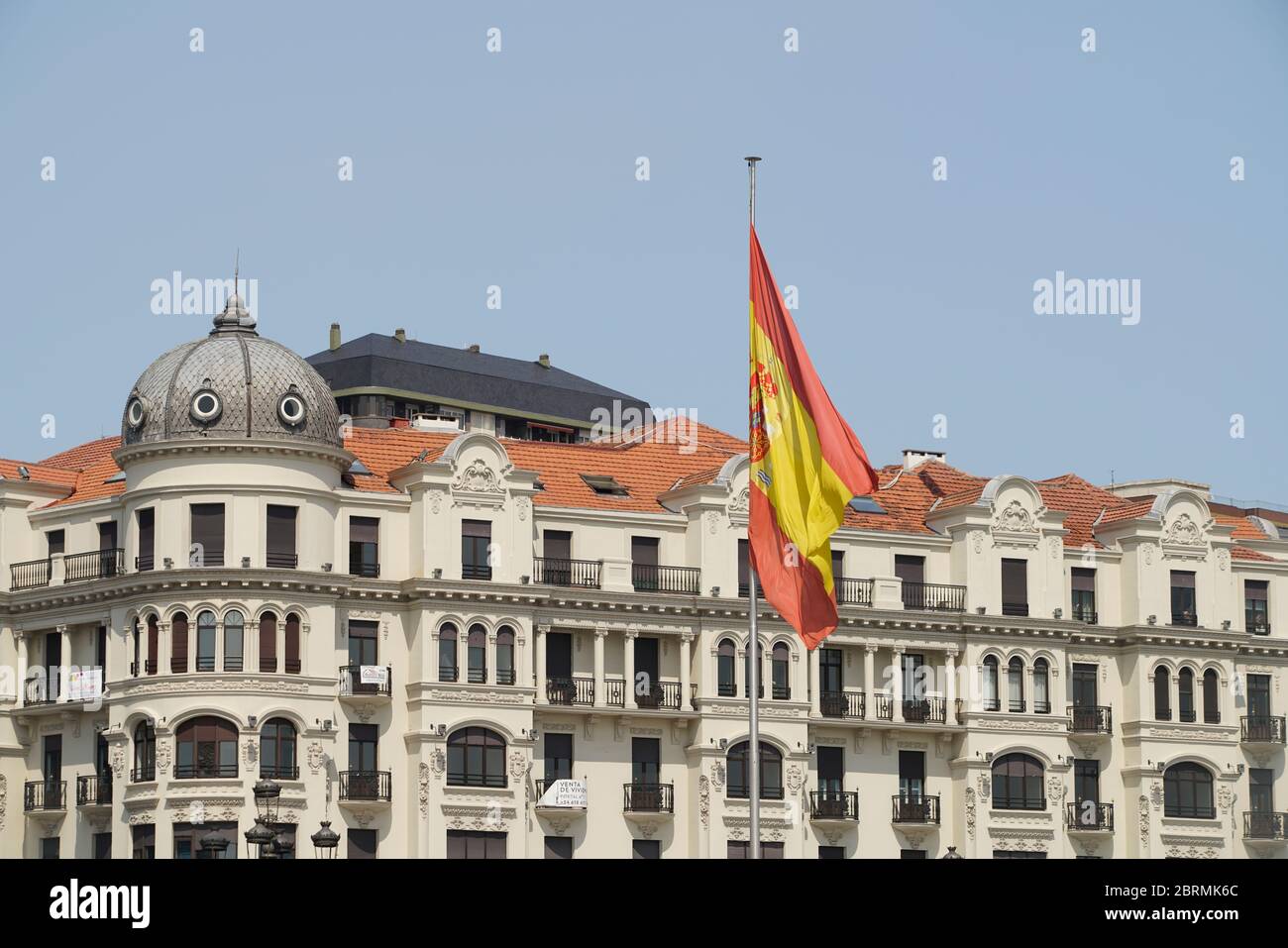 Traditional old building in Santander with a huge spanish flag Stock ...