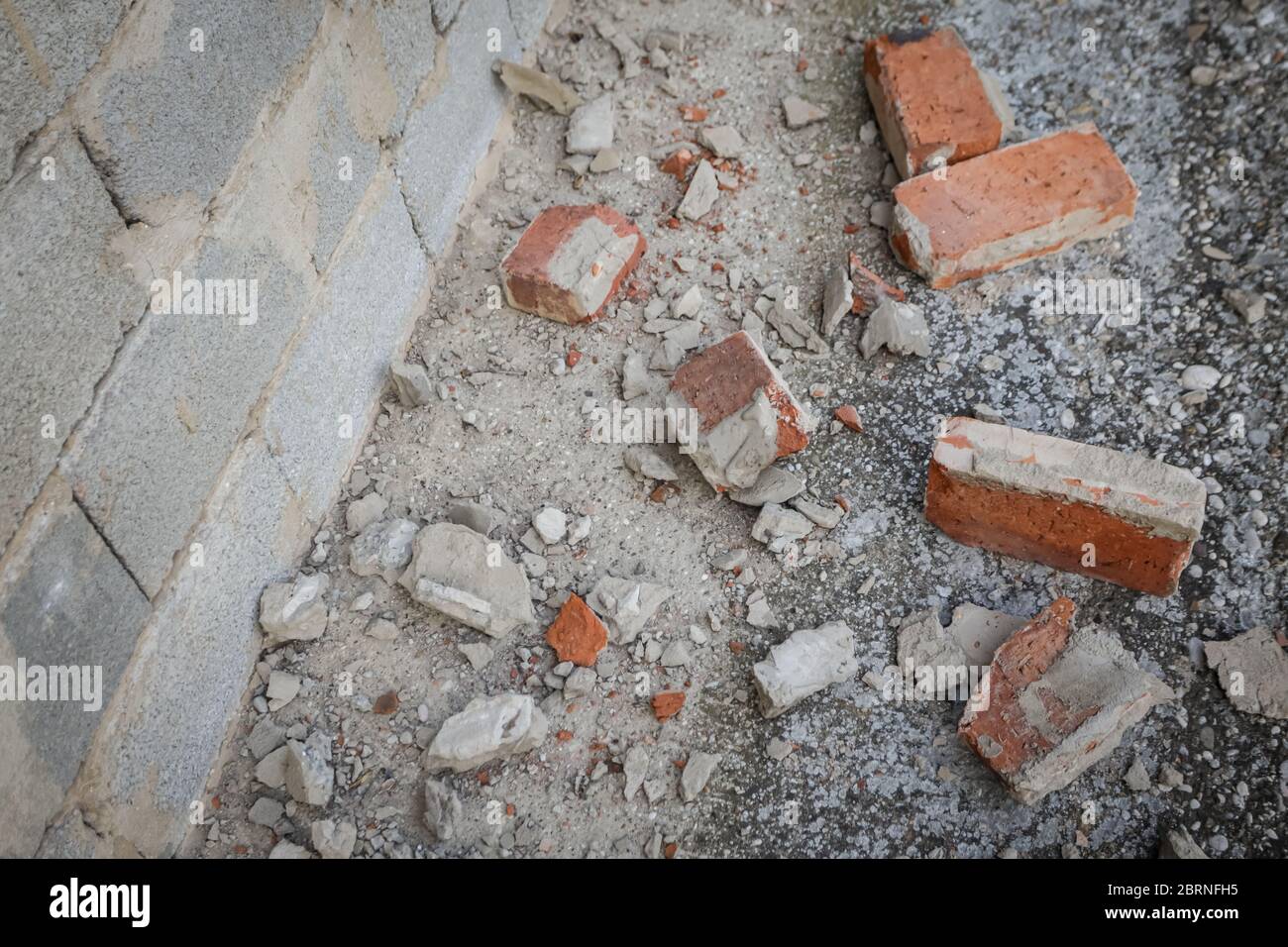 Scattered and damaged bricks on the balcony of the house after a strong ...