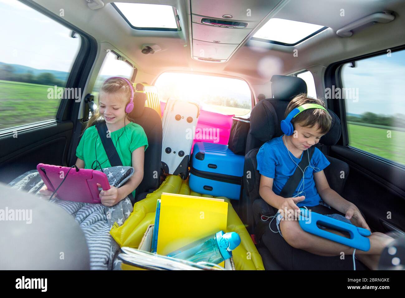 Holidays - Children relax in the car during a long car journey Stock ...