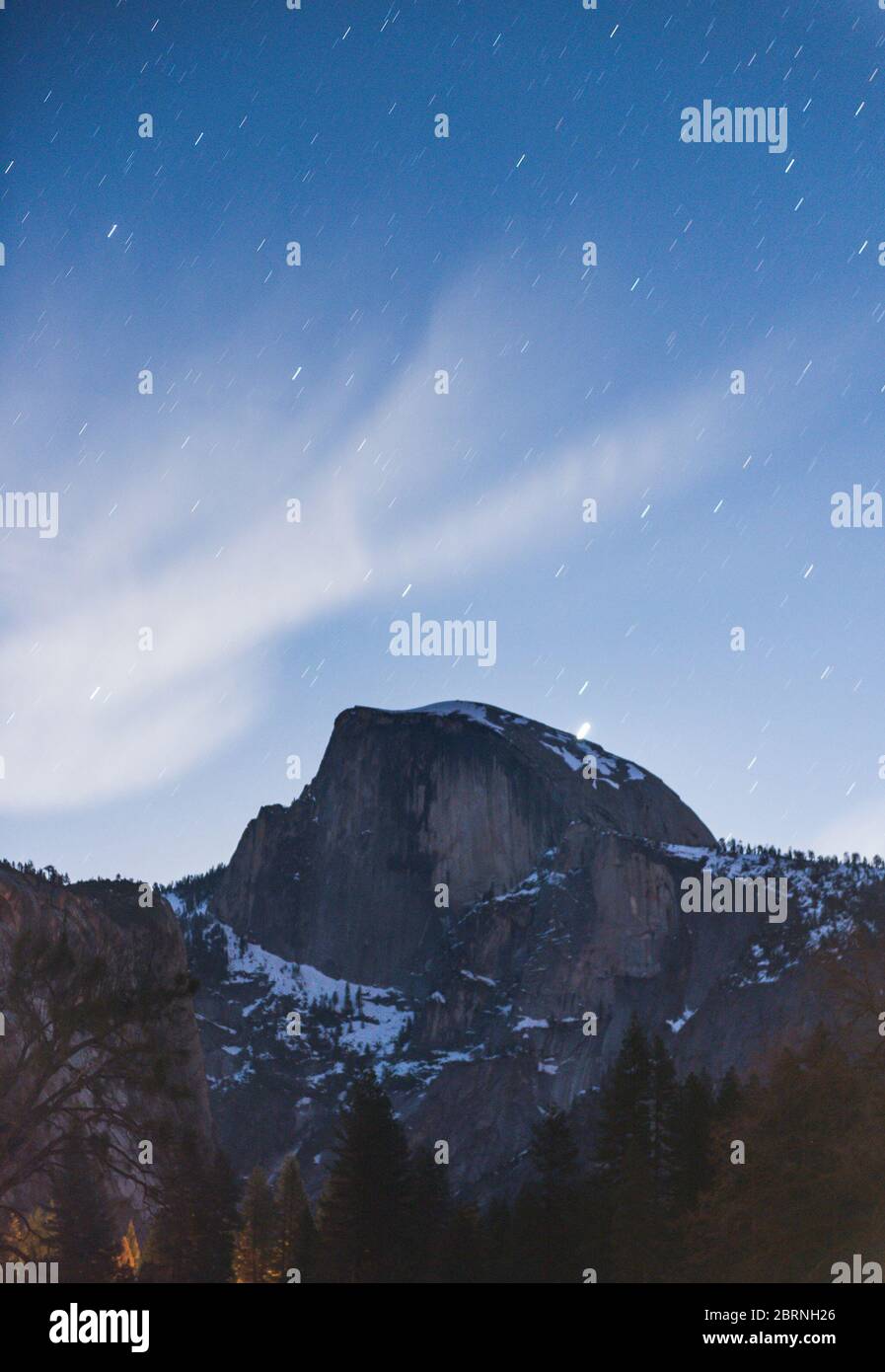 scene of half dome with sky at night before full moon set in Yosemite ...