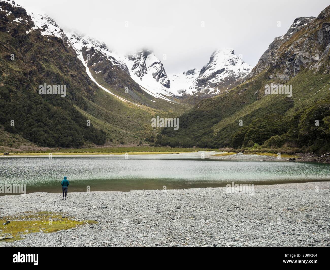 Sole walker at Lake Mackenzie, with Emily Pass in the background ...