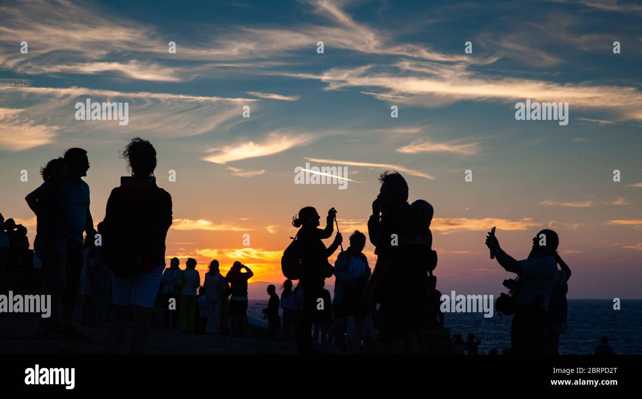 crowd of people watching sunset by the sea Stock Photo - Alamy