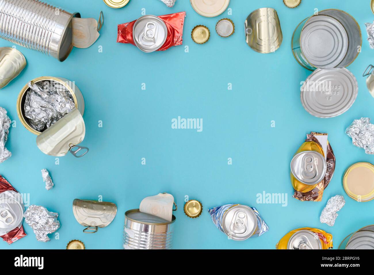Recyclable metal garbage on the blue background. Waste separation ...