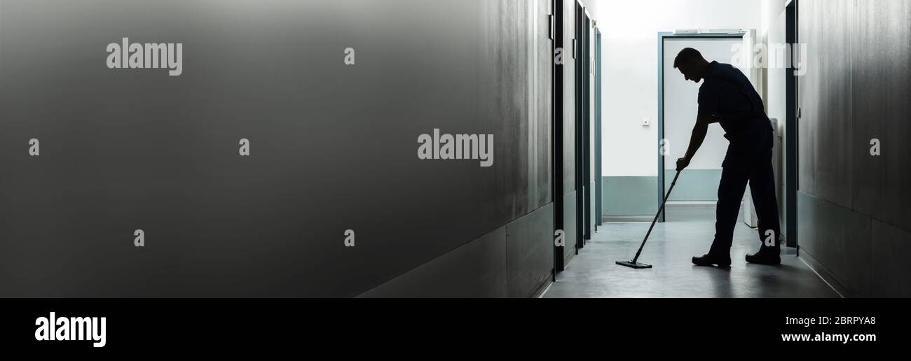 Side View Of Man Cleaning Floor With Mop Stock Photo - Alamy