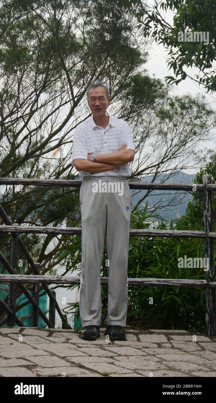 A smiling Hong Kong Chinese man Stock Photo - Alamy