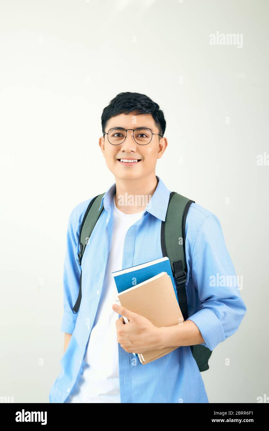 Handsome smiling student holding hi-res stock photography and images ...
