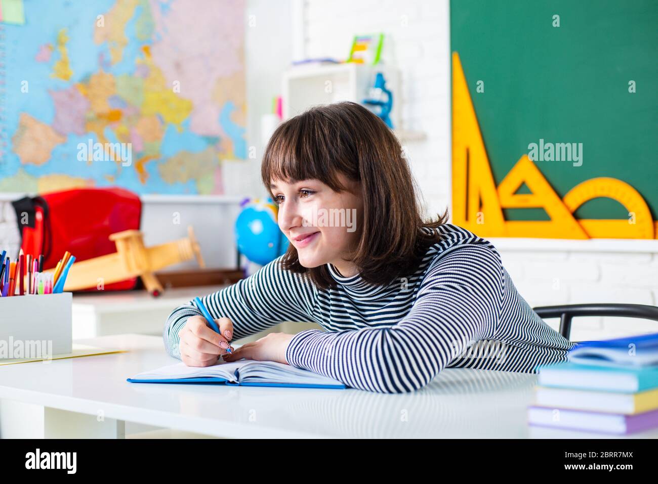 Beautiful student girl in classroom. Portrait of Female University ...