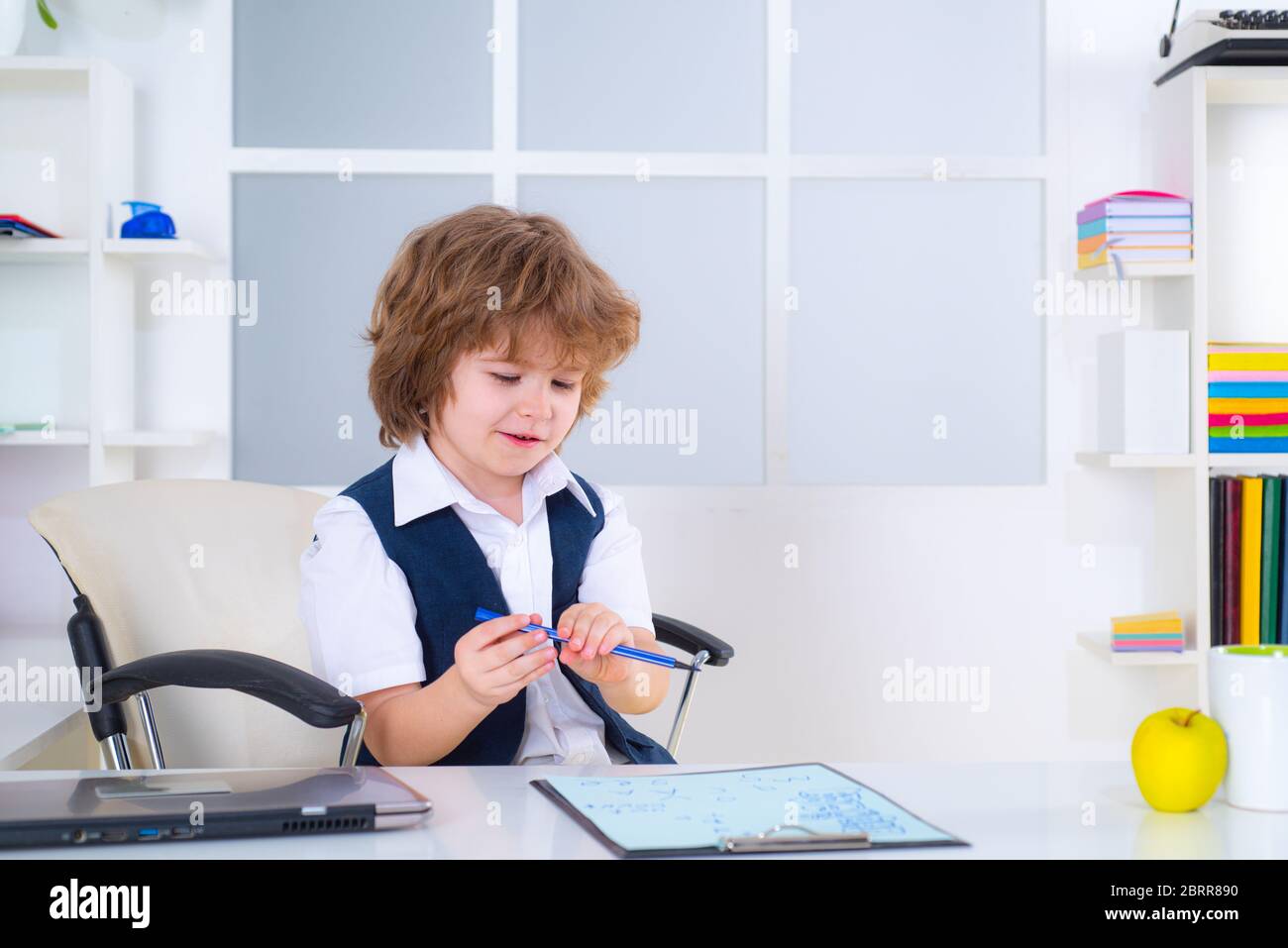 Little child boy business man working in office Stock Photo - Alamy