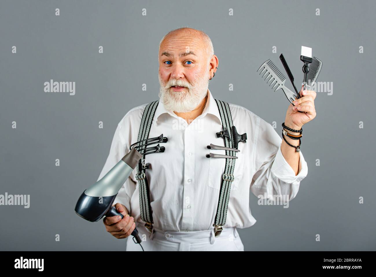 Senior barber with straight razor. Professional senior hairdresser on ...