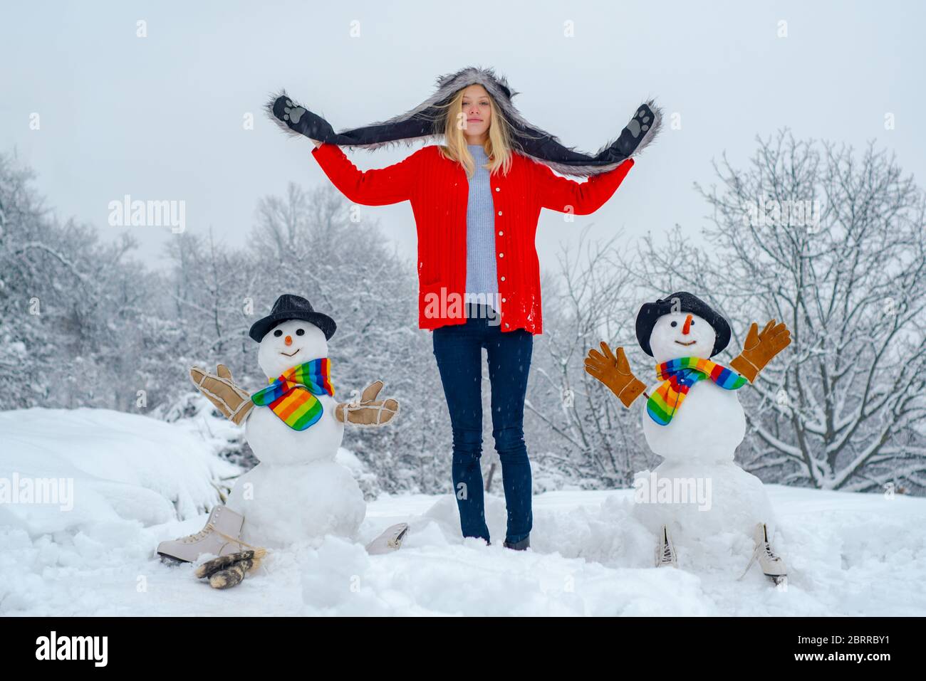 Woman making snowman hi-res stock photography and images - Alamy
