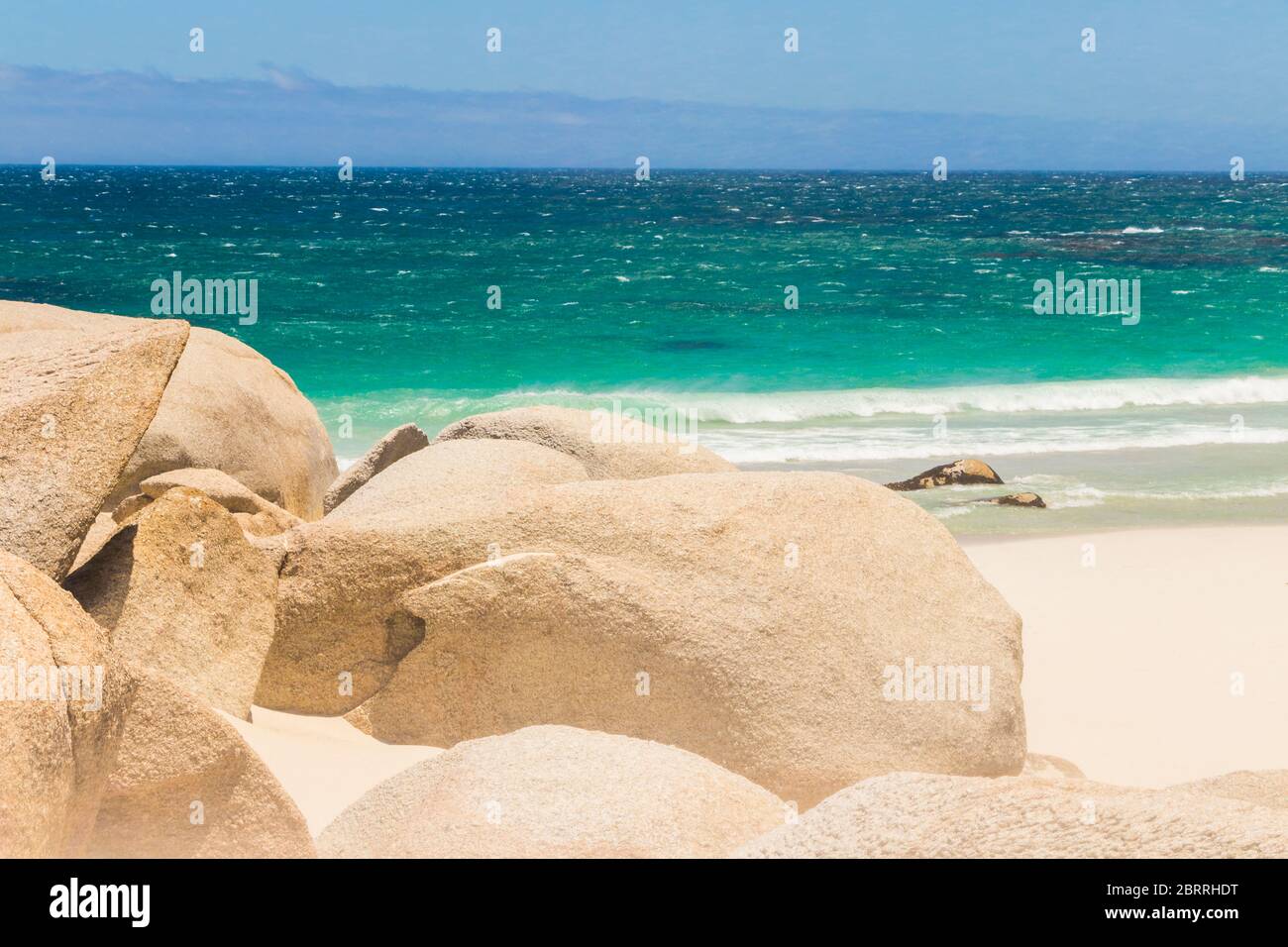 Camps Bay Beach turquoise water white sand and rocks in Cape Town ...