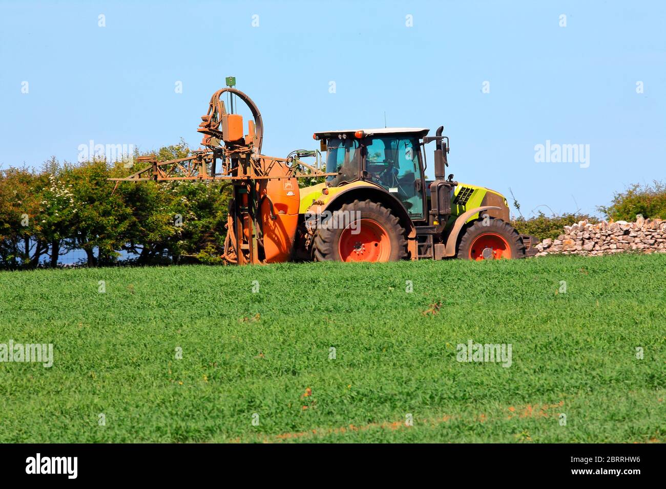 Crop spraying the whole field with this tractor mounted spray unit ...