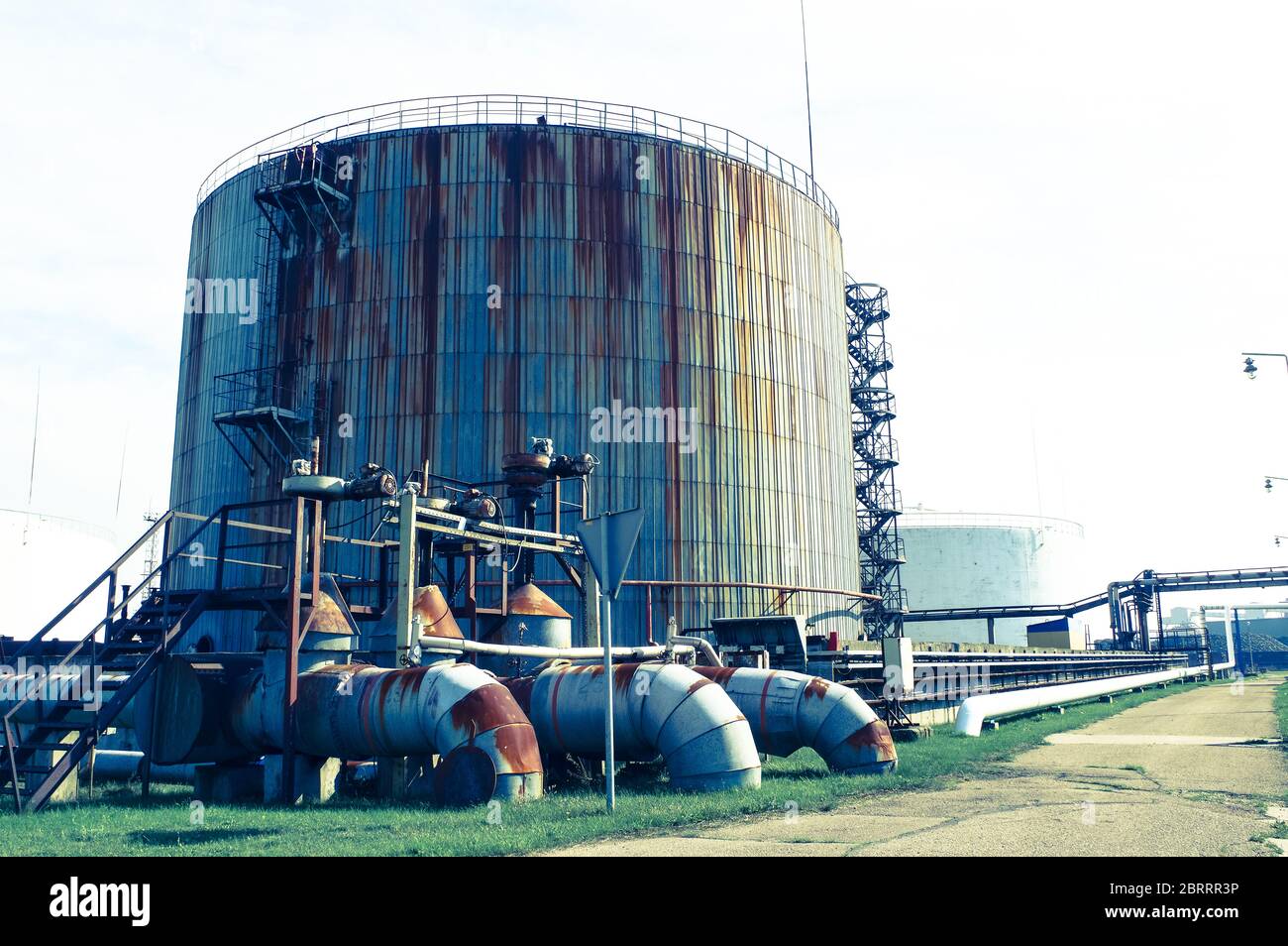 Crude oil tank in the oil refinery. Storage tanks for oil. Tanks for ...