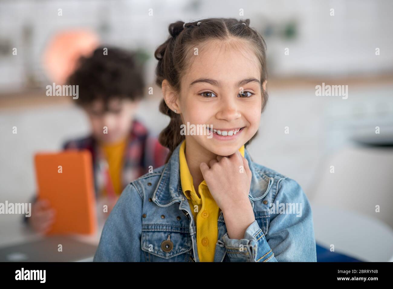 Boy with chin on table hi-res stock photography and images - Alamy