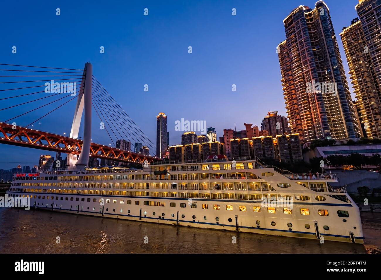 Chongqing, China - August 2019 : Brightly lit huge passenger ship ...