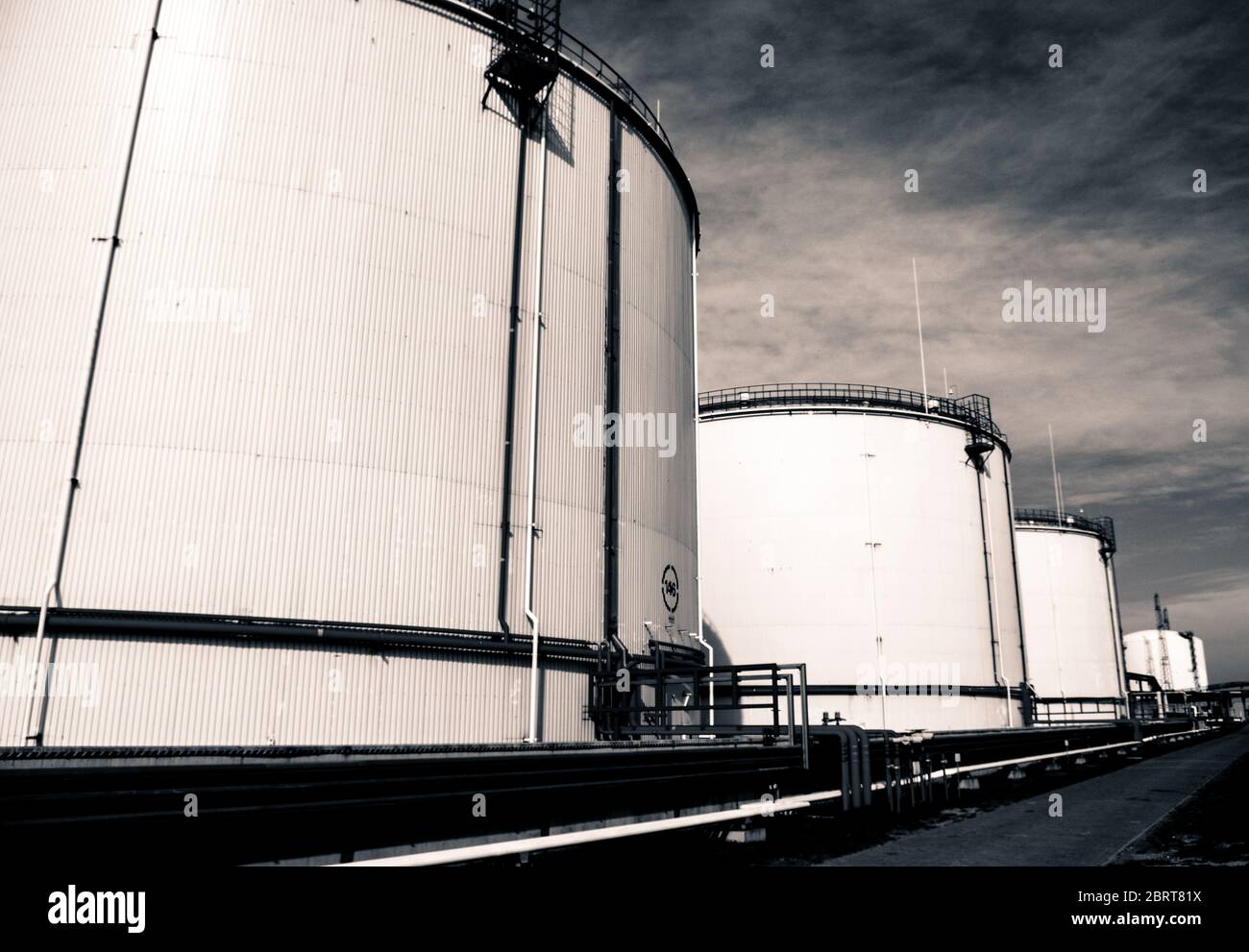 Crude oil tank in the oil refinery. Storage tanks for oil. Tanks for ...