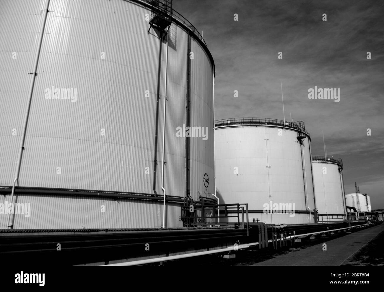 Crude oil tank in the oil refinery. Storage tanks for oil. Tanks for ...