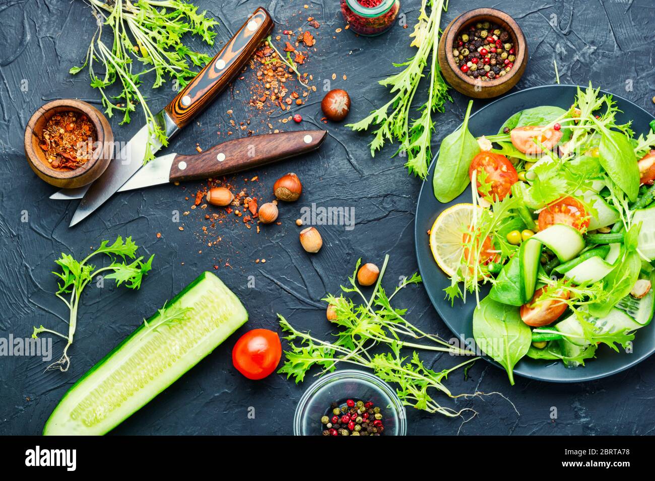 Spring green salad with vegetables and nuts.Diet menu Stock Photo - Alamy