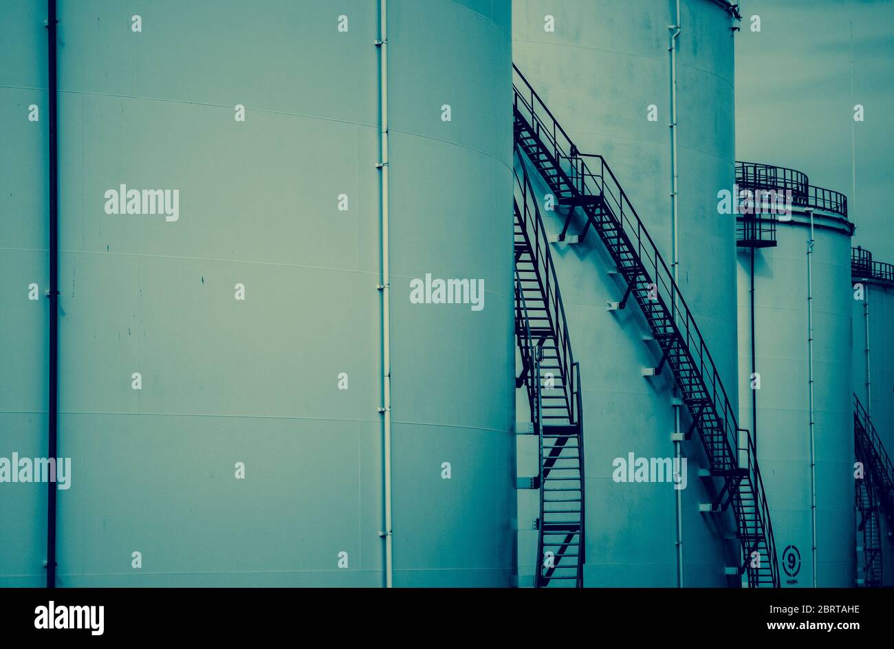 Crude oil tank in the oil refinery. Storage tanks for oil. Tanks for ...