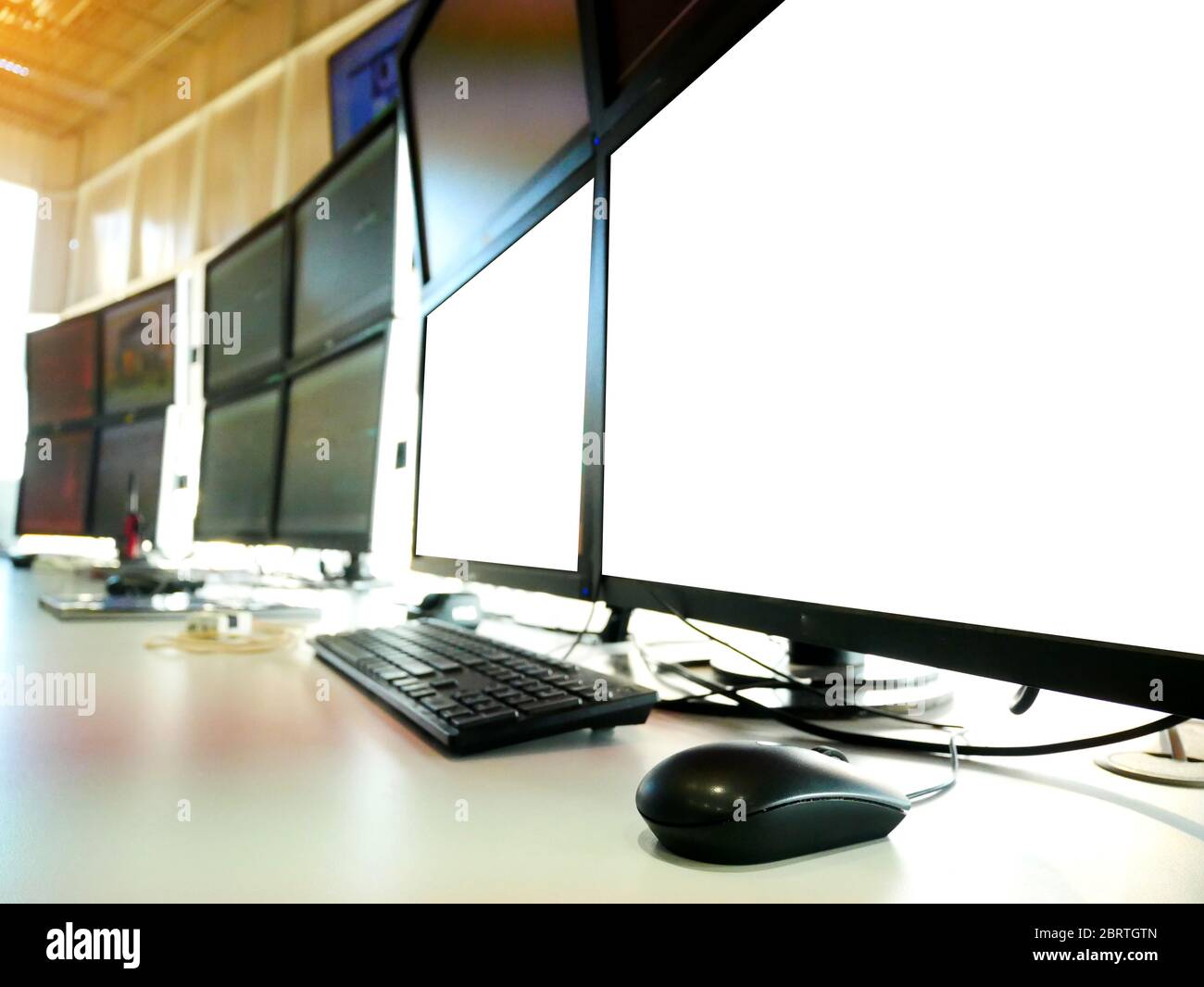 White copy space inside monitor with keyboard and mouse, control room ...