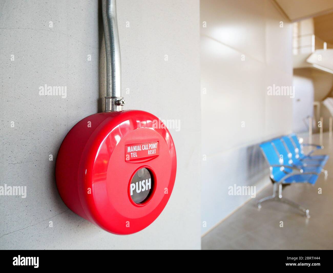 Fire alarm manual station on wall in modern office building or factory ...