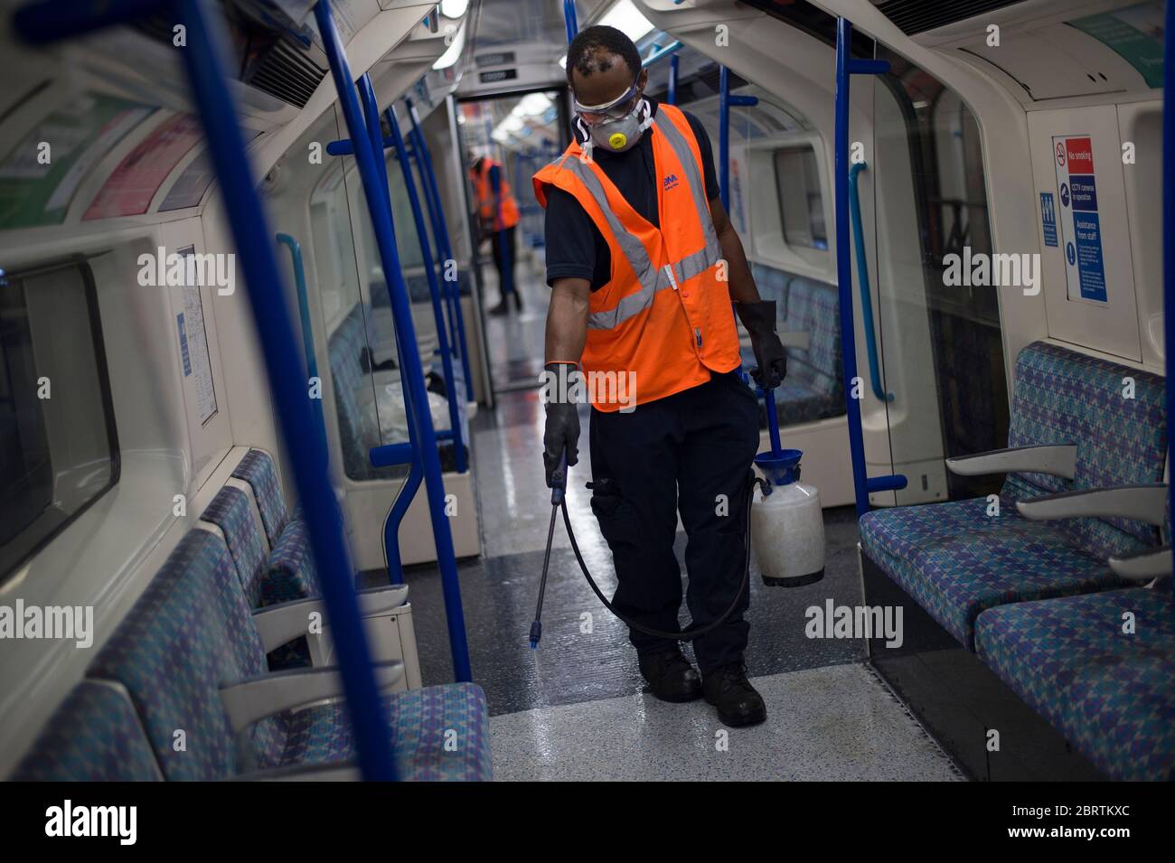 A TfL worker deep cleans a Victoria Line tube train at the London ...