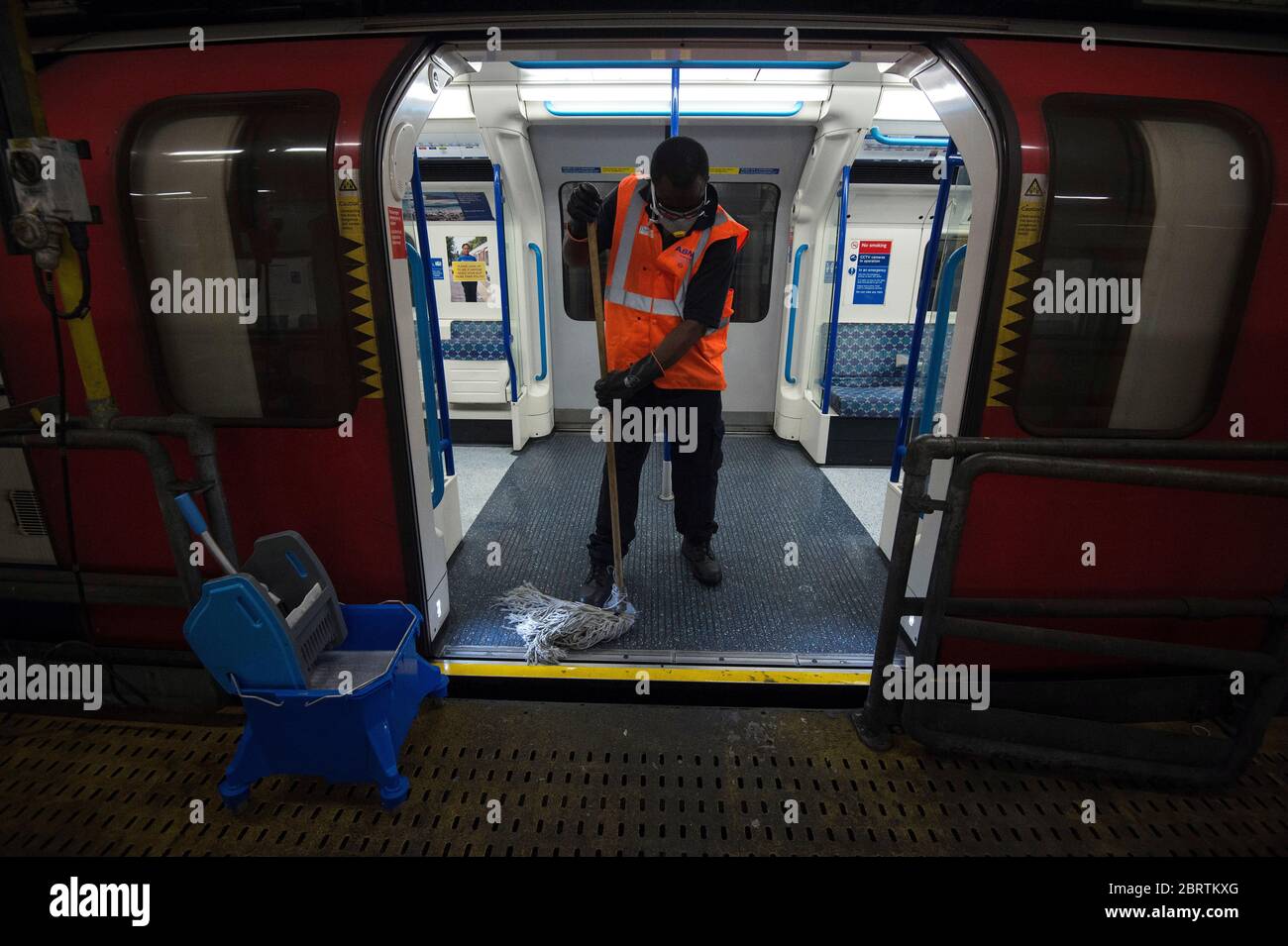 A TfL worker deep cleans a Victoria Line tube train at the London ...