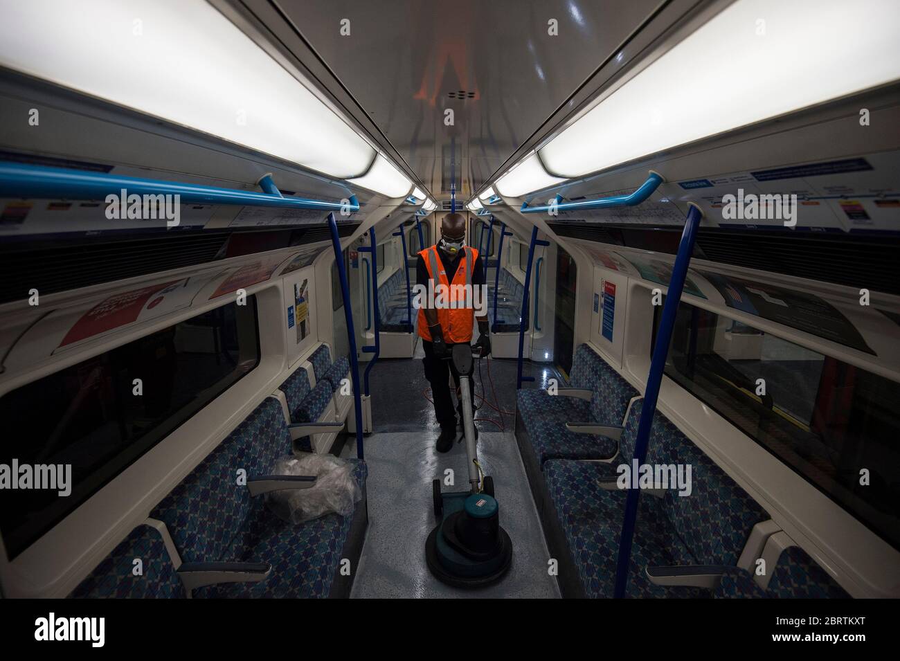 A TfL worker deep cleans a Victoria Line tube train at the London ...