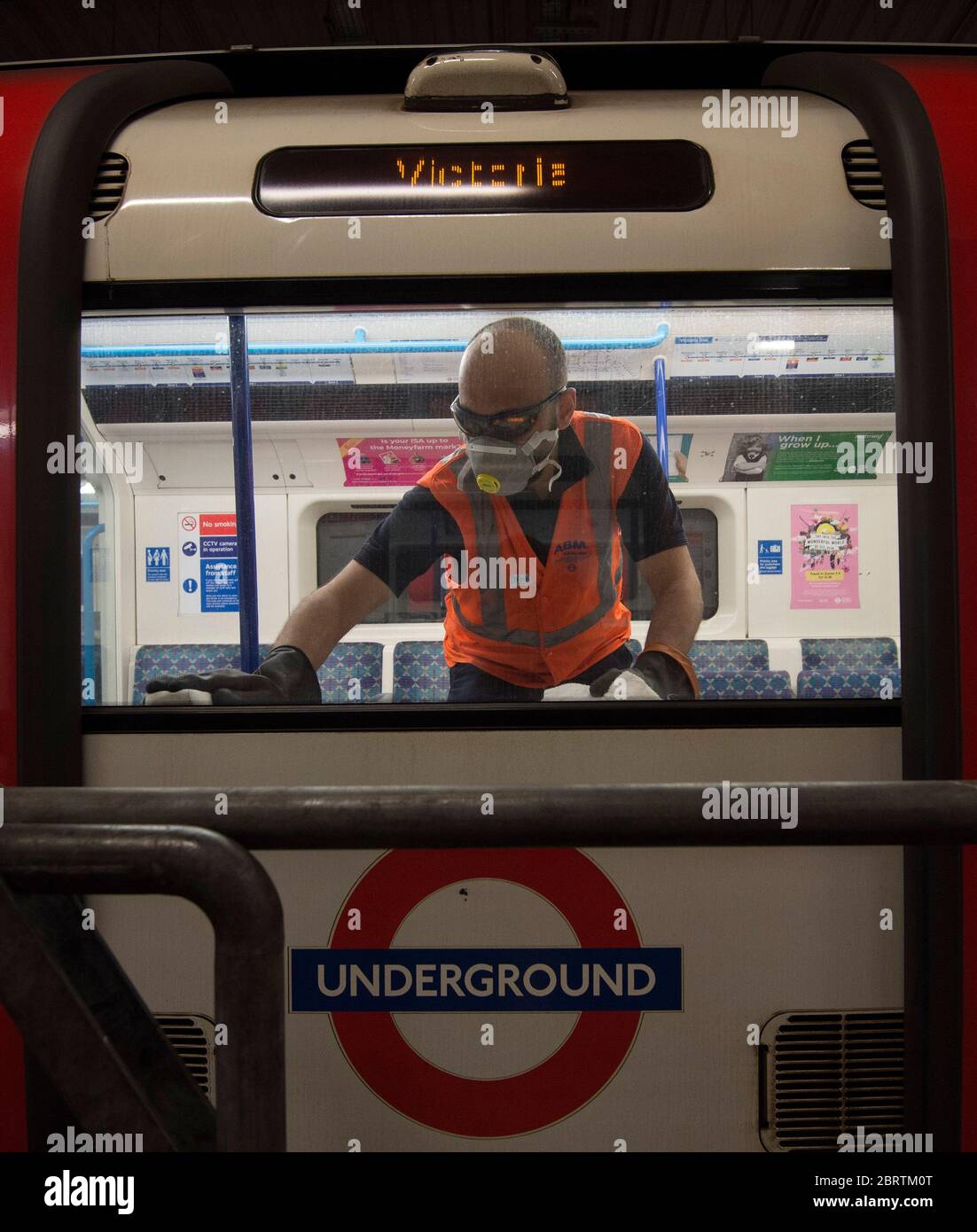 A TfL worker deep cleans a Victoria Line tube train at the London ...
