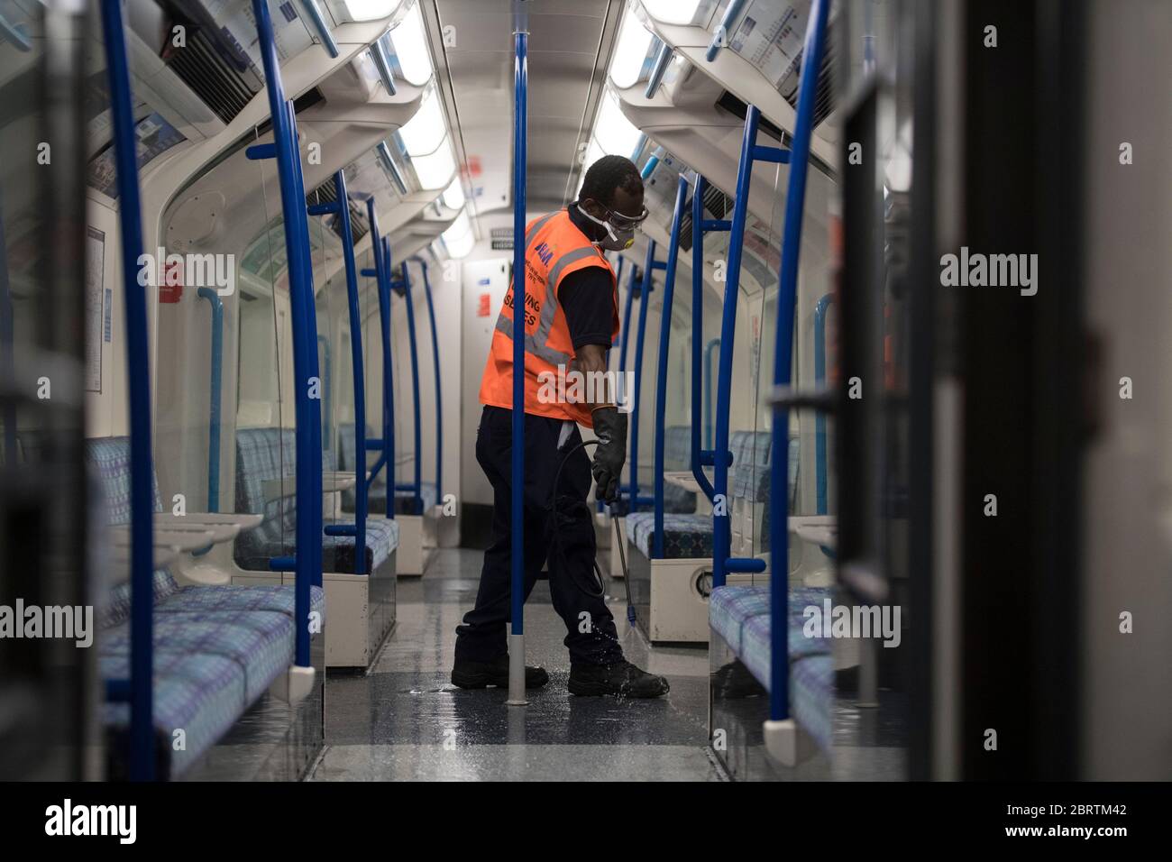 A TfL worker deep cleans a Victoria Line tube train at the London ...